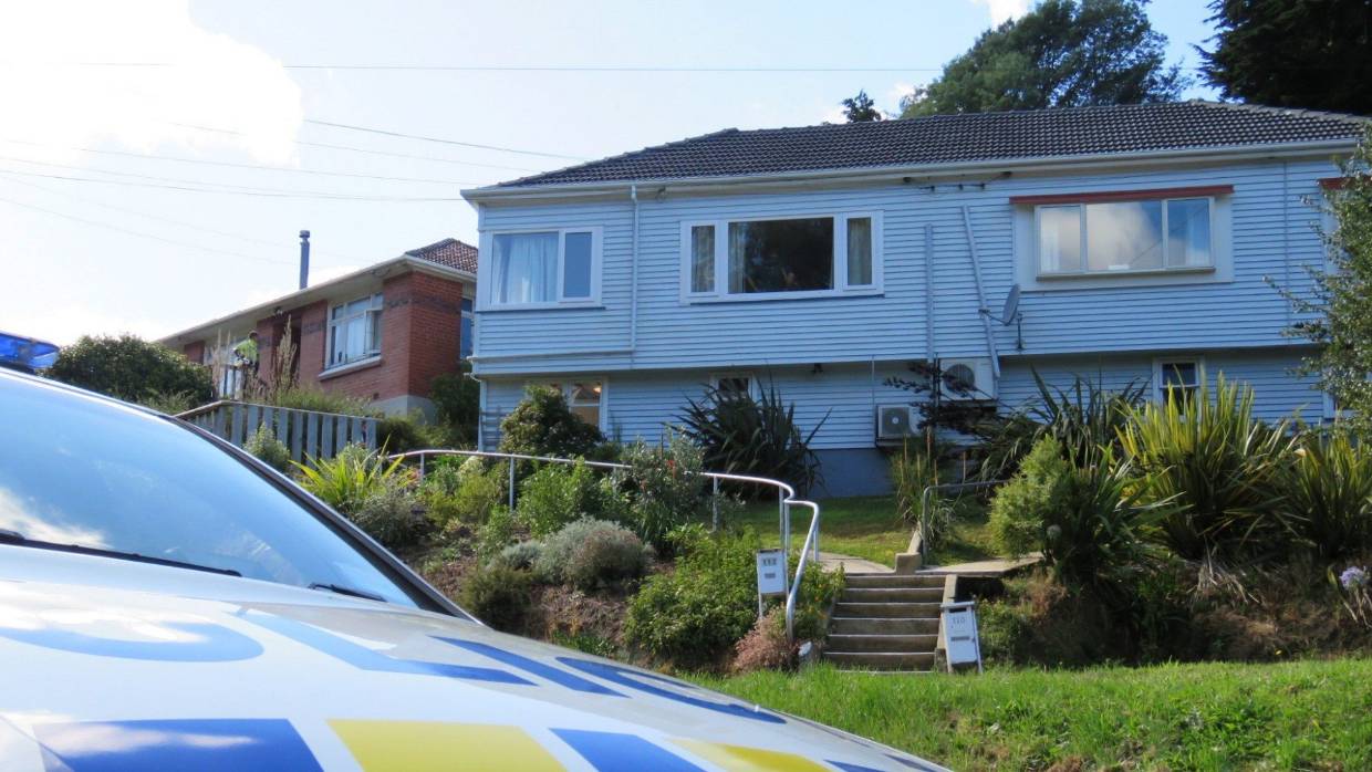 Police guard a property on Somerville St, Dunedin, where the alleged ...